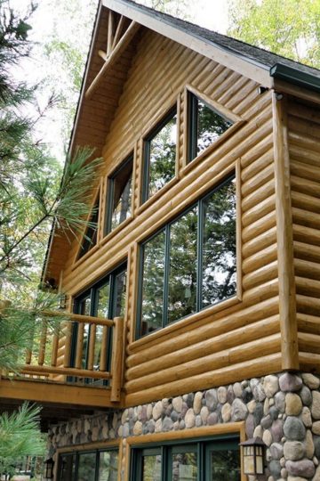 Island Lake Home is a Rustic Log Cabin with Modern Kitchen