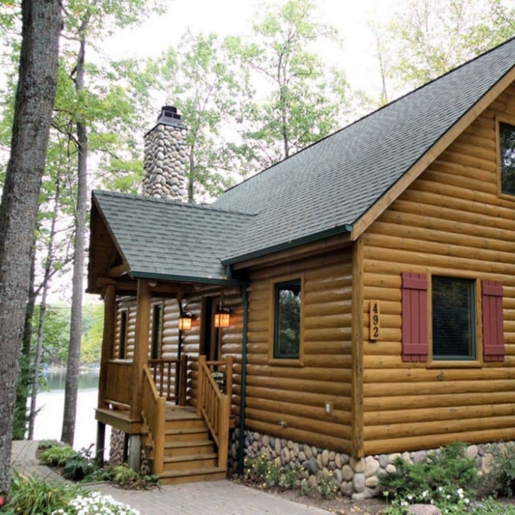 Island Lake Home is a Rustic Log Cabin with Modern Kitchen