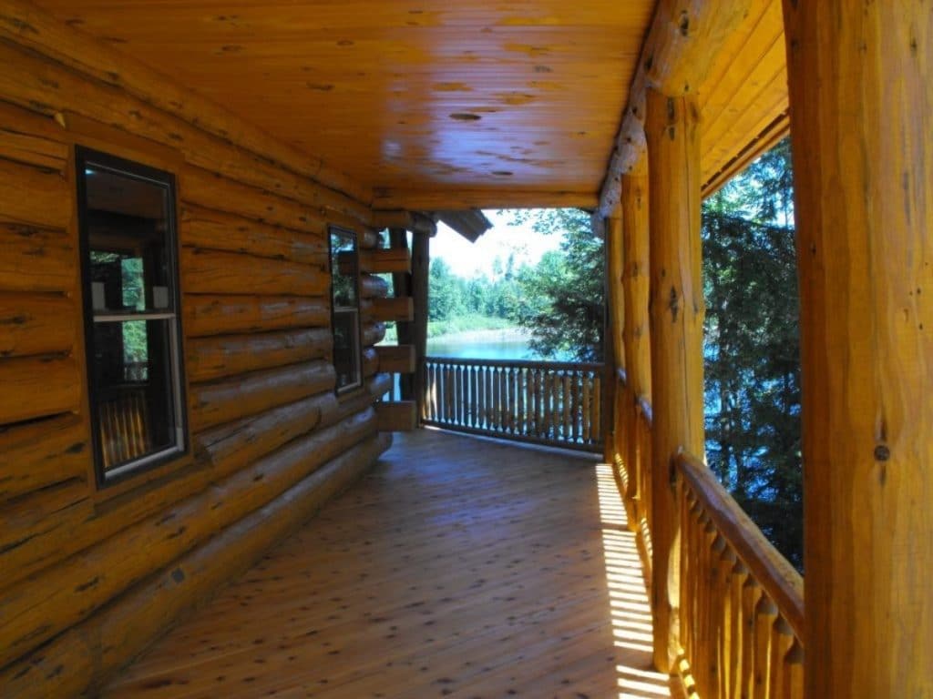 The Water's Edge Log Cabin Has Gorgeous Covered Porches