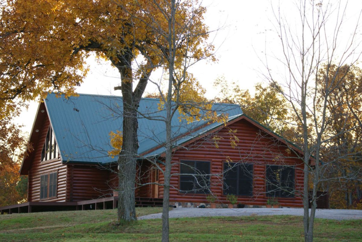 The Custom Pleacher Log Cabin Has Stunning Chef's Kitchen