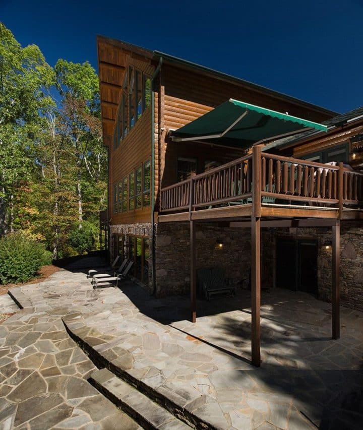 The Multi-Level Bennett Log Cabin Features Elevated Ceilings